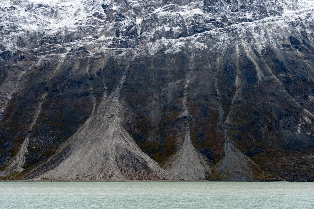 Talus cones and cliffs alongside fjord, Greenland – Geology Pics